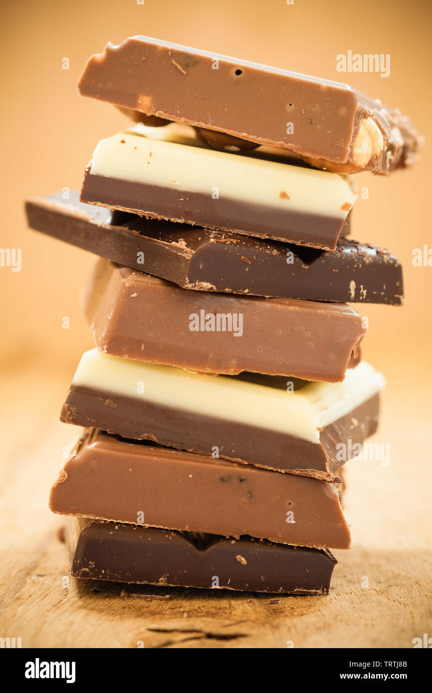 Closeup stack of different sorts chocolate pieces. Variety of ...