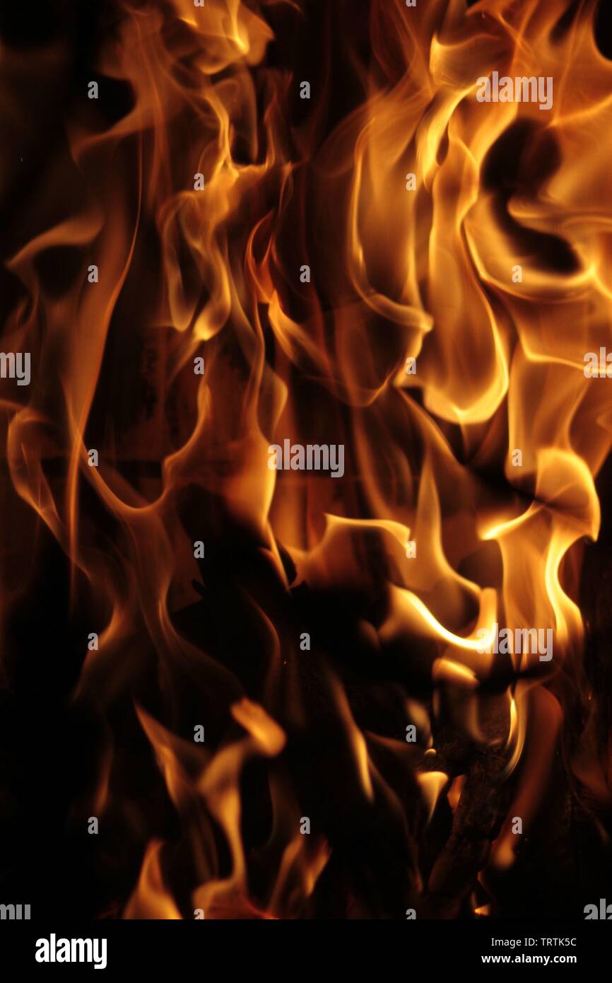 Fire scene texture with black background Stock Photo - Alamy