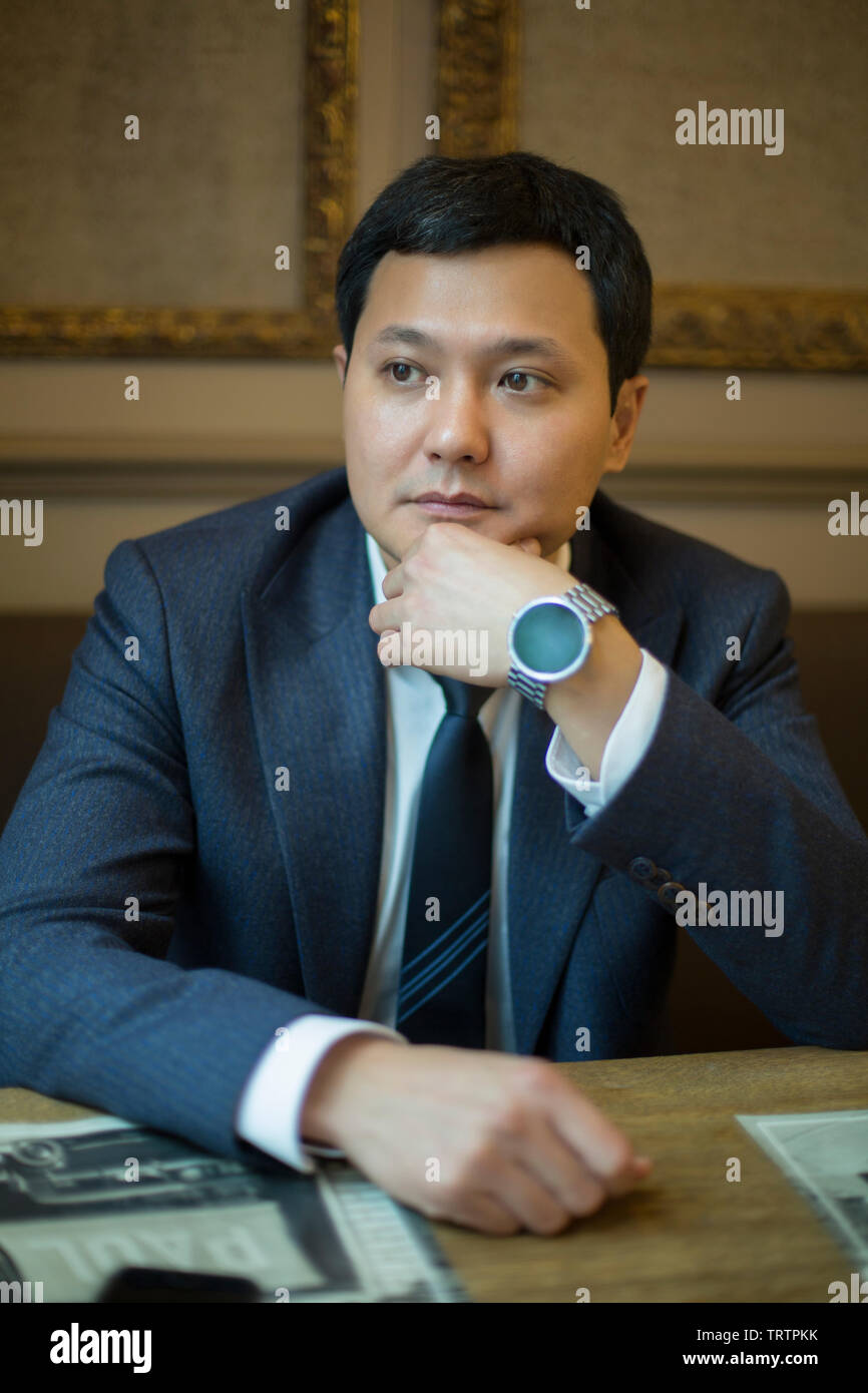 Asian businessman in black suit Stock Photo - Alamy