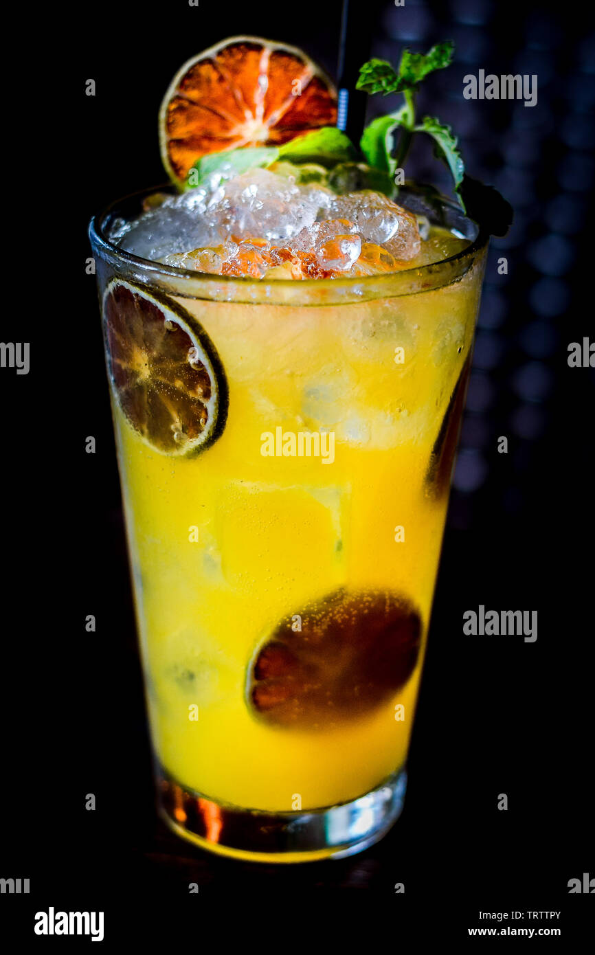 Vodka or rum with homemade falernum, ginger beer and passionfruit in a ...