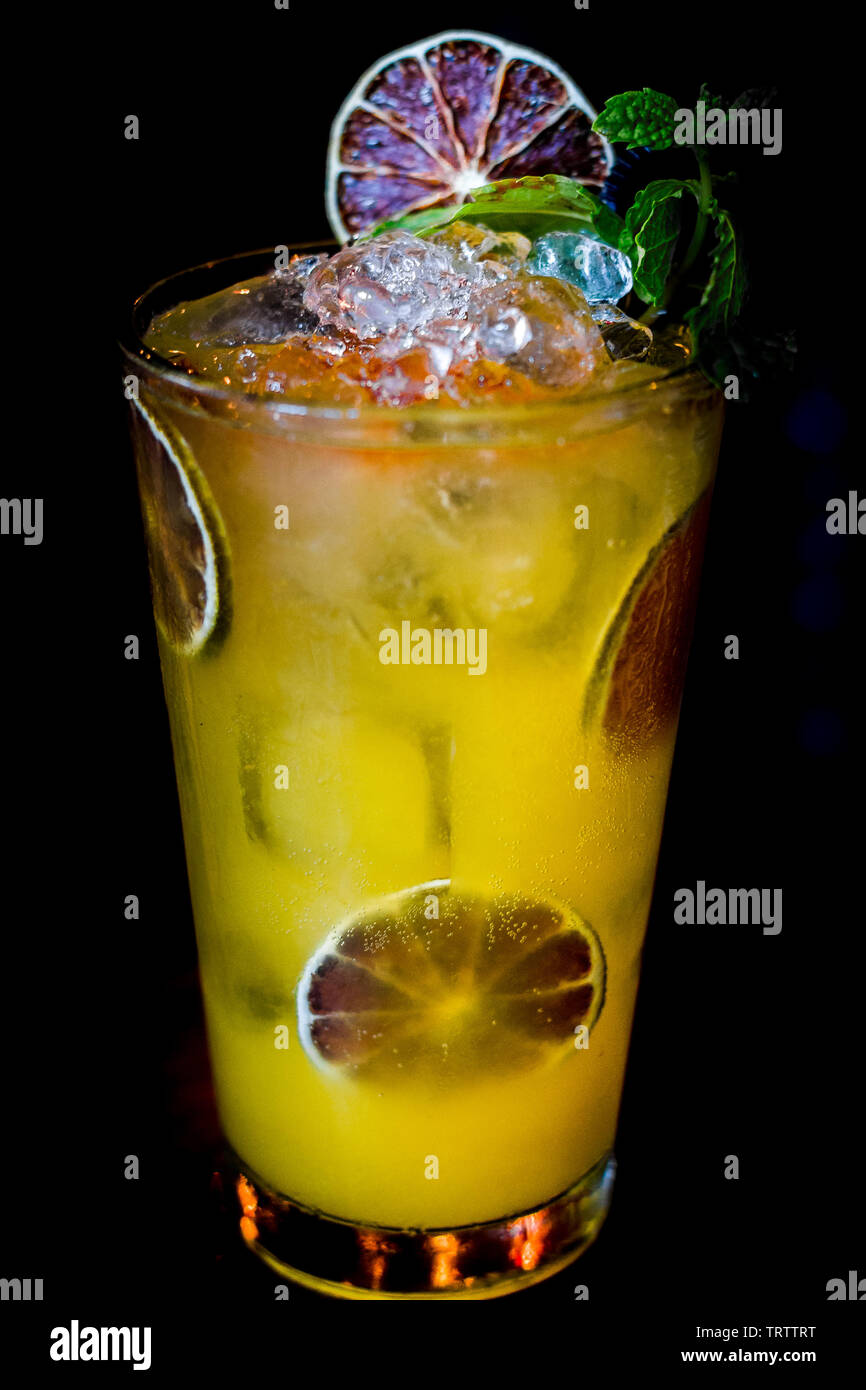 Vodka or rum with homemade falernum, ginger beer and passionfruit in a ...