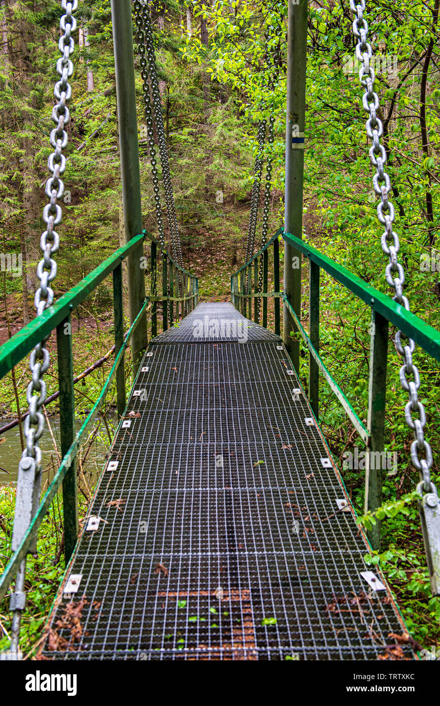 metal chain and wire rope holding bridge in place. steel construction ...
