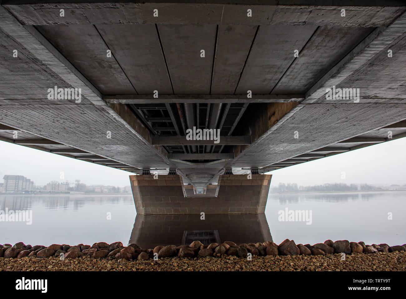concrete brick bridge over the river with high clear water stream Stock ...