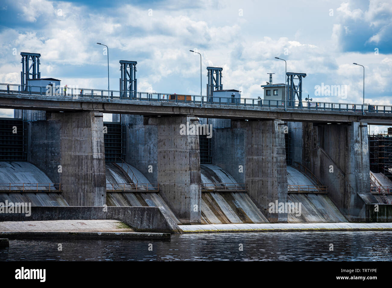 concrete brick bridge over the river with high clear water stream Stock ...