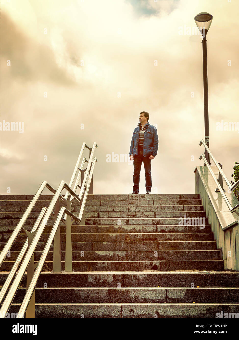 solitude adult man thinking about future at the top of the ladder Stock ...