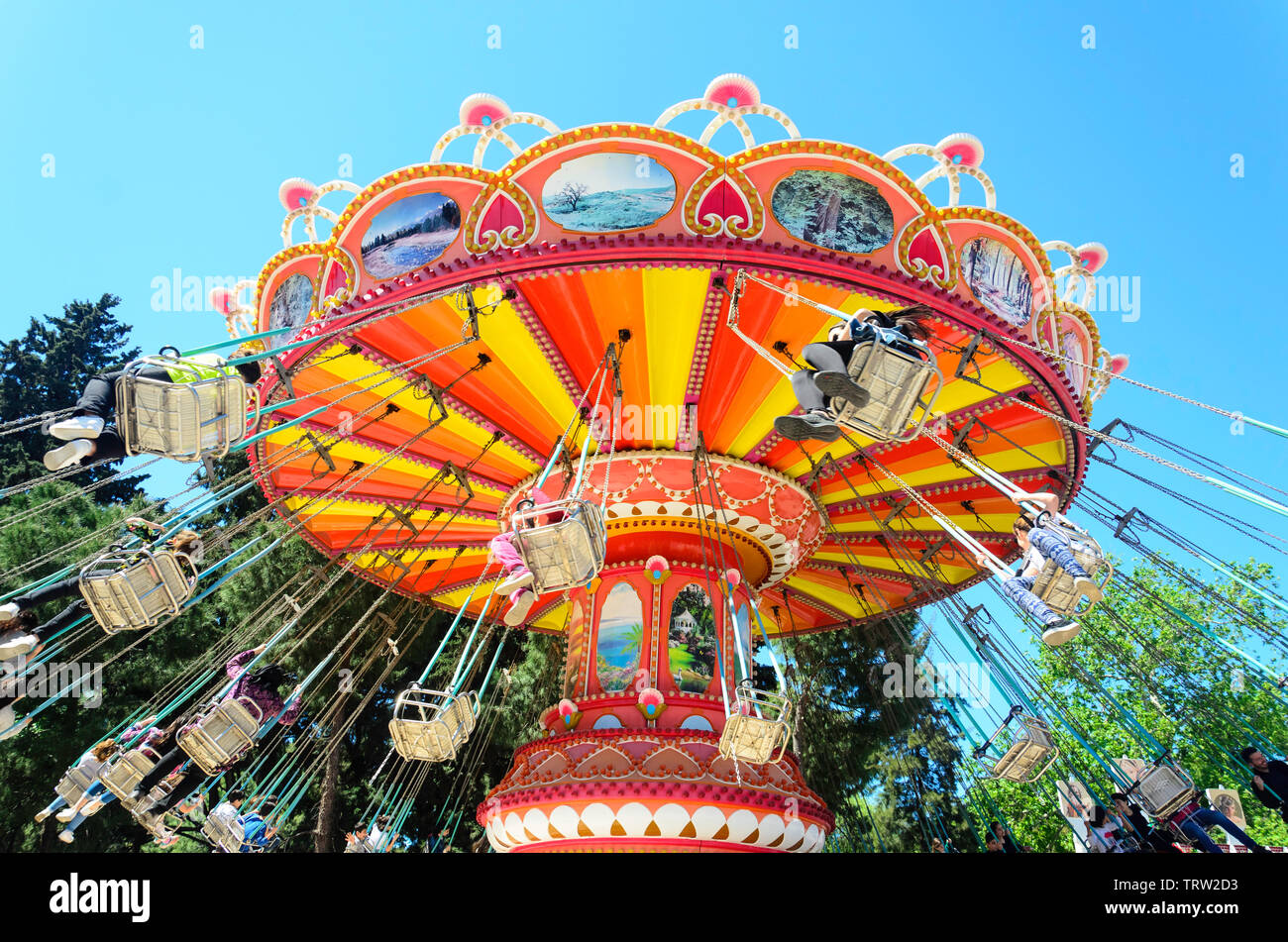 Children enjoy riding a Chairoplane Stock Photo - Alamy