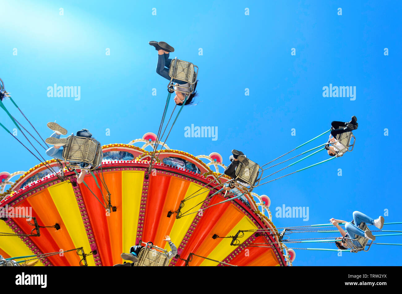 Children enjoy riding a Chairoplane Stock Photo - Alamy