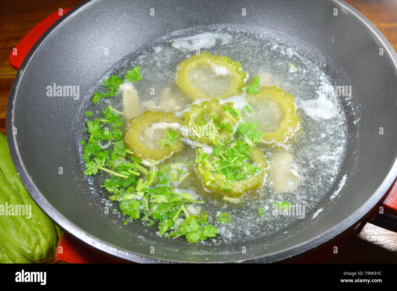 bitter cucumber boiled in hot pot Stock Photo - Alamy