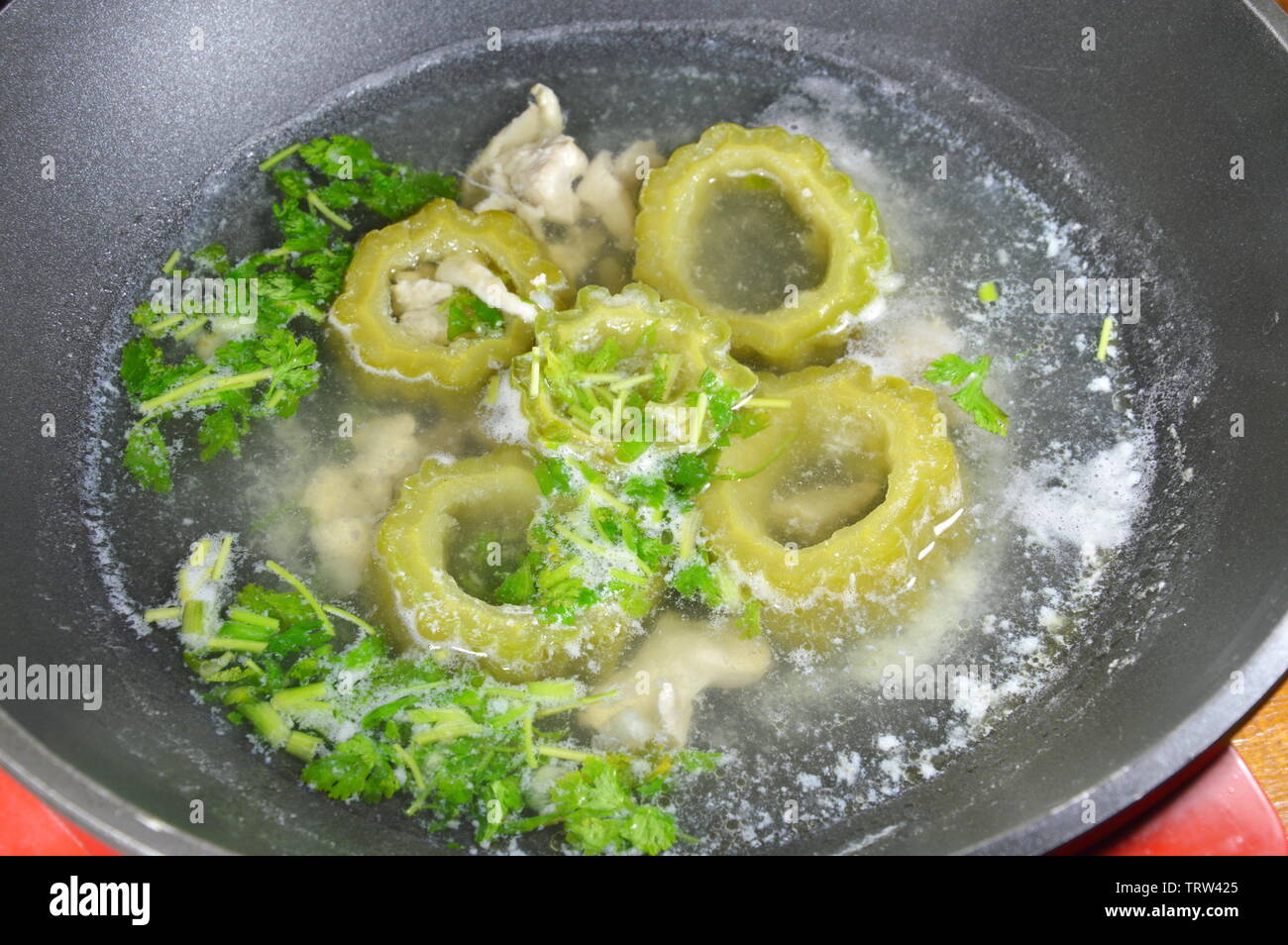 bitter cucumber boiled in hot pot Stock Photo - Alamy