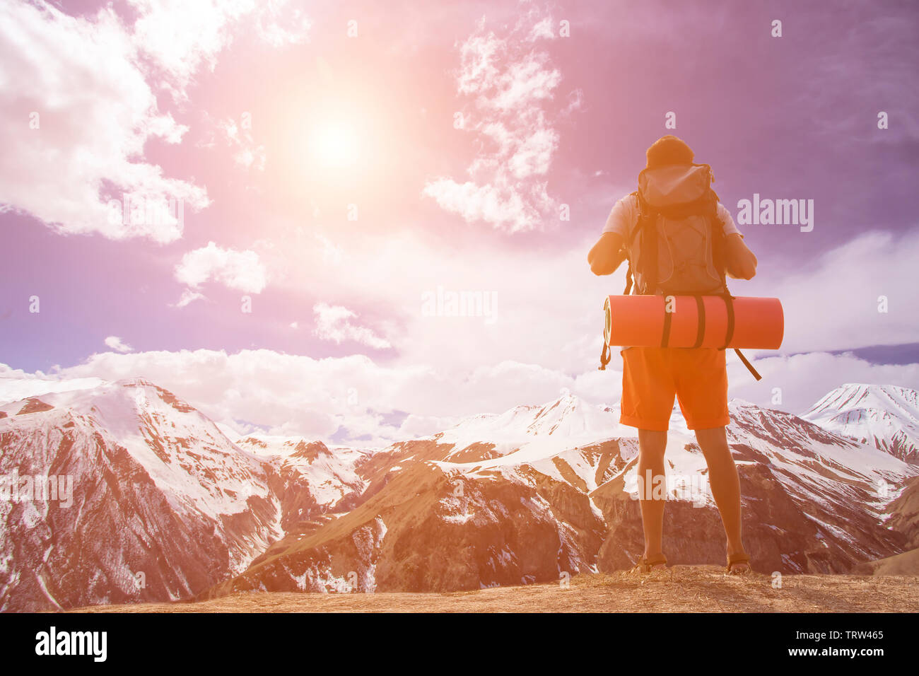Man hiker greeting rich nature on the top of mountain Stock Photo - Alamy