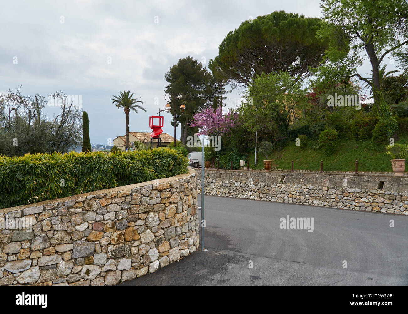 Mougins, France - April 03, 2019: Red square head sculpture at entrance ...
