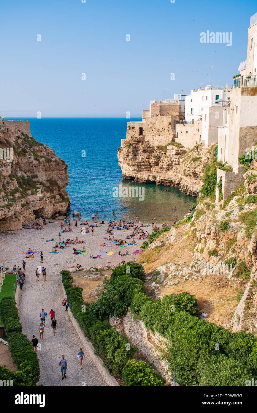 Panoramic city skyline with white houses and beach, town on the rocks ...