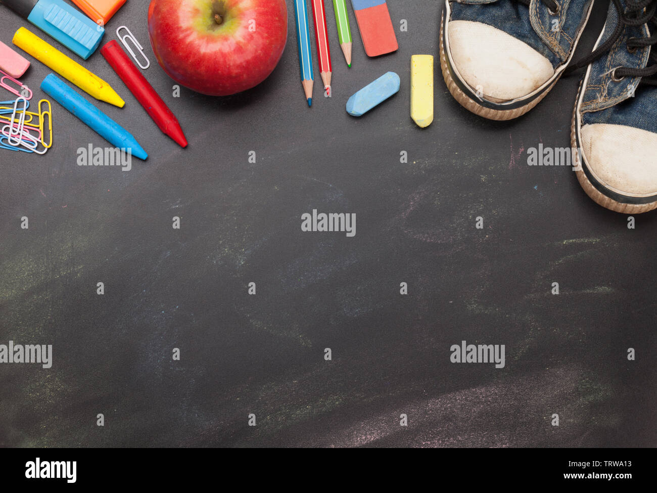 School education supplies on chalkboard backdrop. Back to school ...