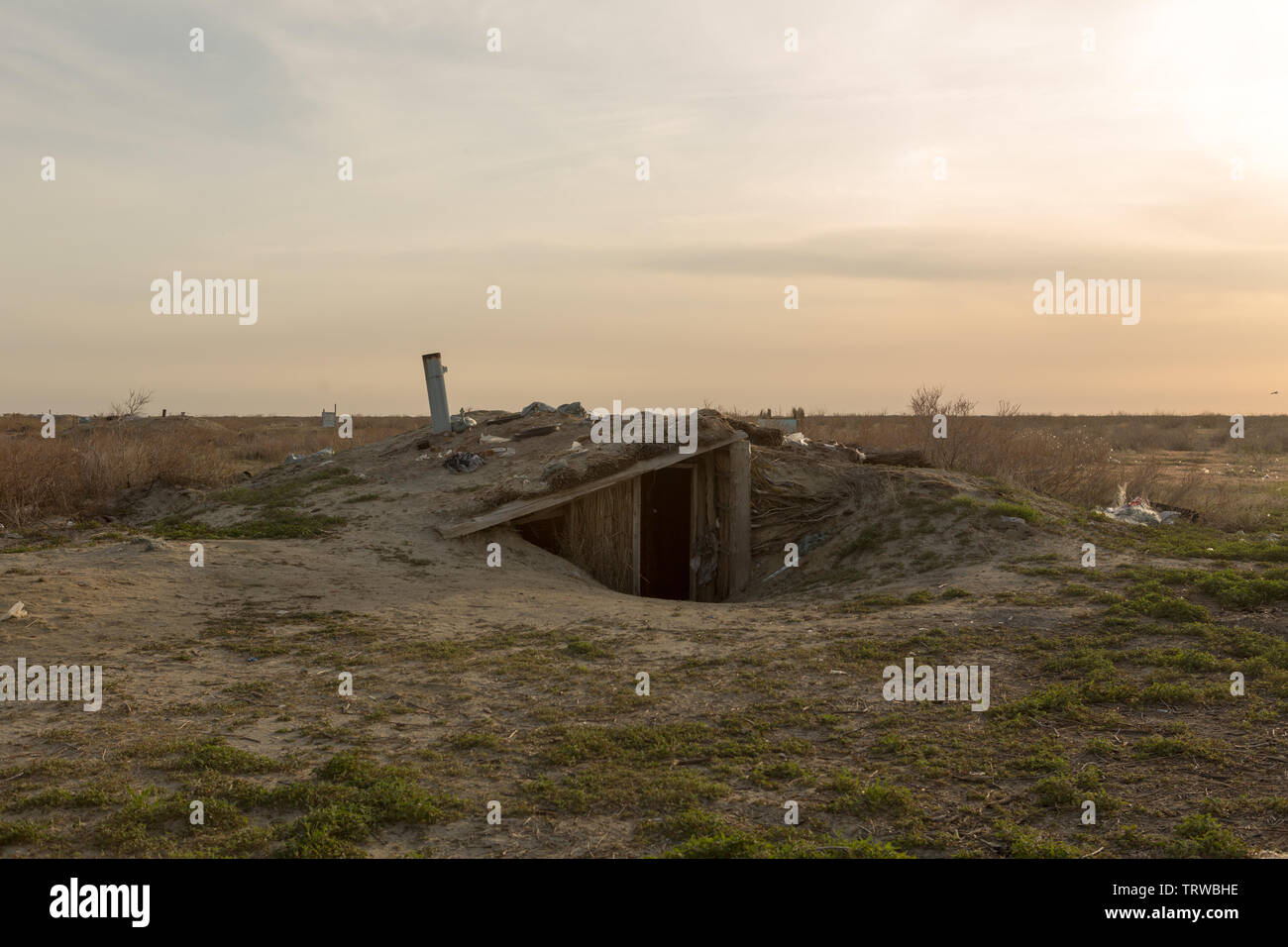Old house in the ground Stock Photo - Alamy