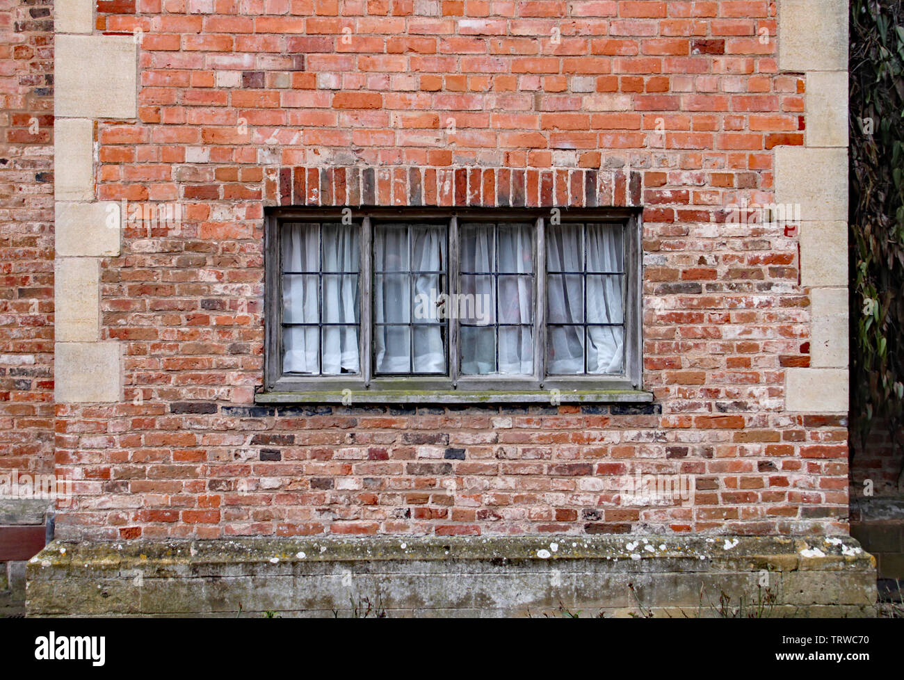 Old wooden window in a weathered brick wall in an old manor house Stock ...