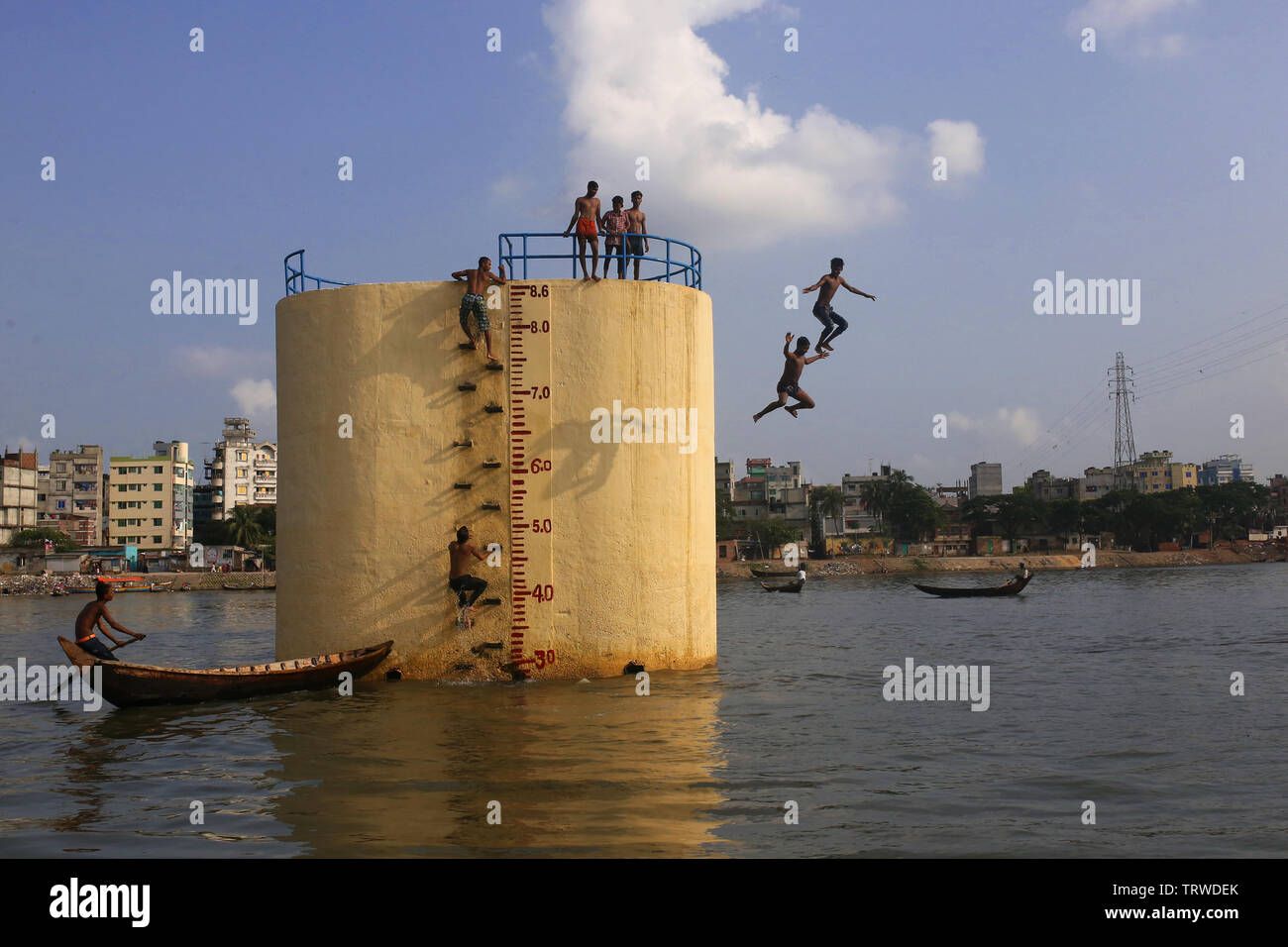 Dhaka, Bangladesh- June 10, 2019: Youths dive into Buriganga river ...