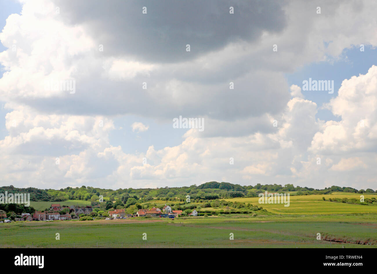 A view of Salthouse village in North Norfolk over the coastal marshes ...