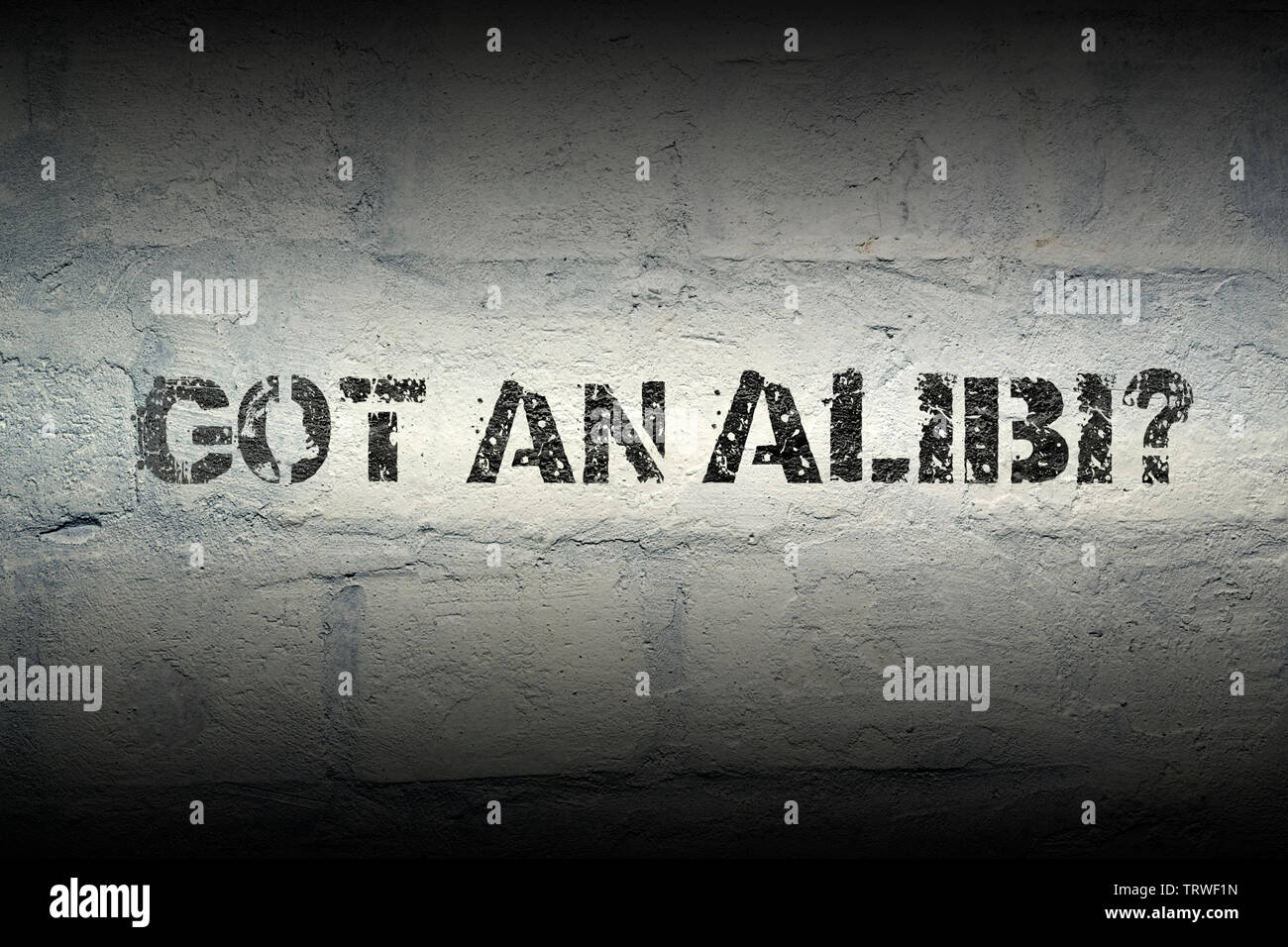 got an alibi stencil print on the grunge white brick wall Stock Photo ...