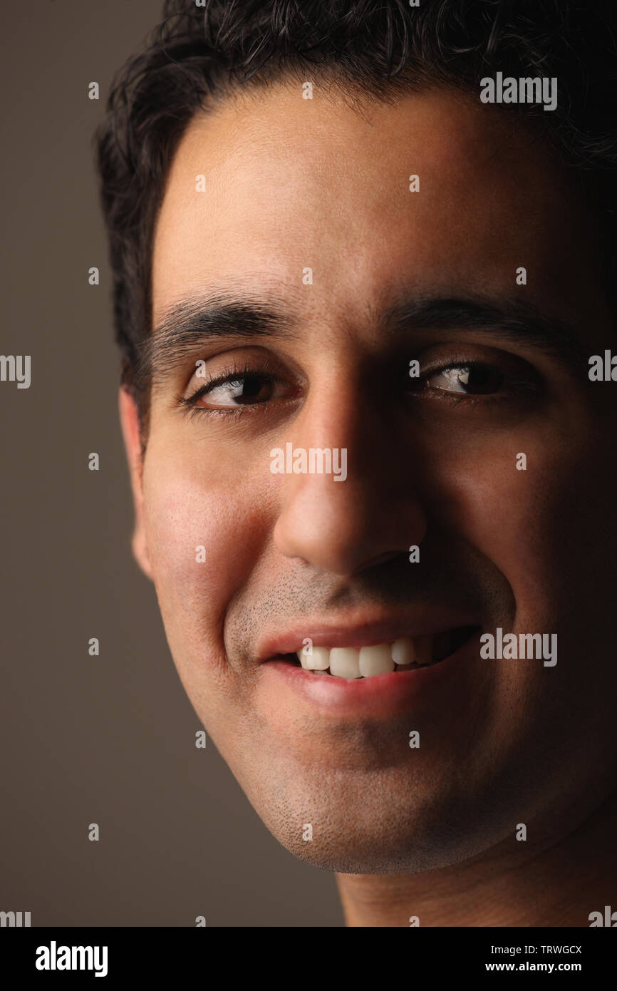 Close up of an Indian man smiling Stock Photo - Alamy