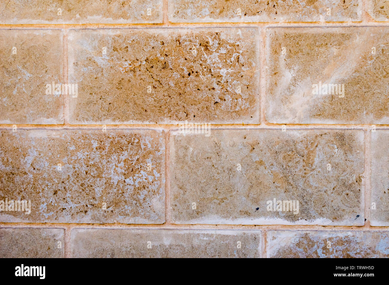 Stone Brick Background. Detail of yellow rough stone brick background ...