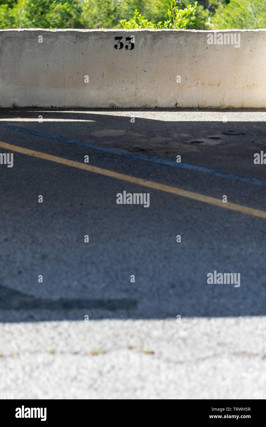 Parking area. Number 33 on the wall Stock Photo - Alamy