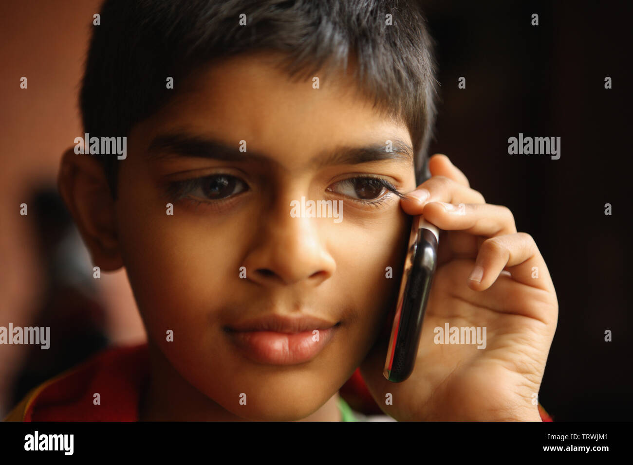 Boy talking on a mobile phone Stock Photo - Alamy