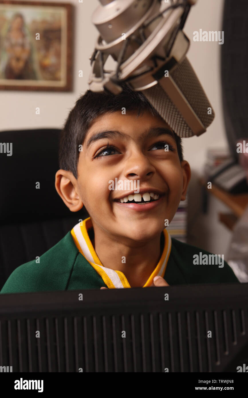 Indian boy singing microphone hi-res stock photography and images - Alamy