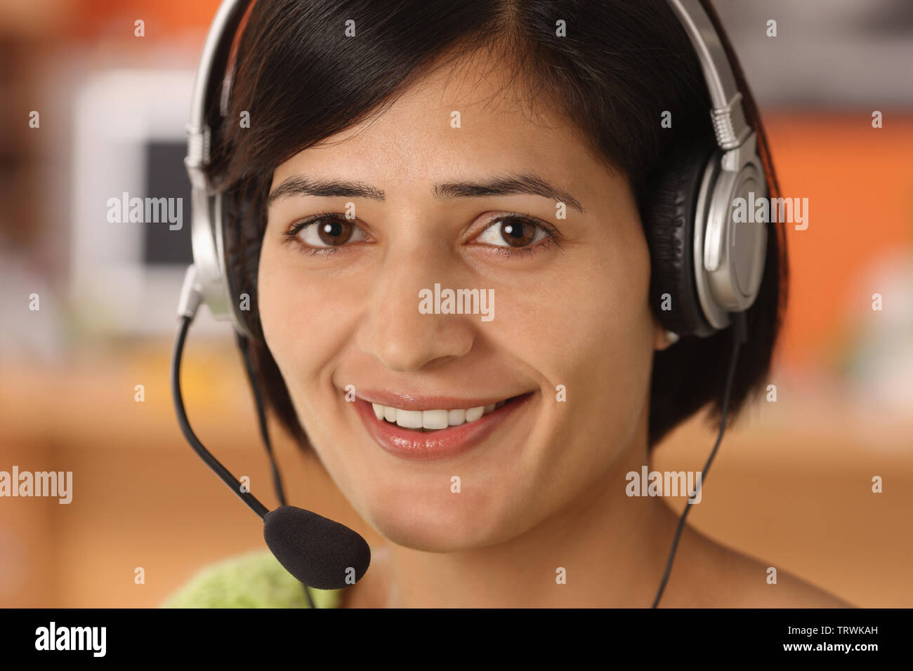 Woman wearing a headset Stock Photo - Alamy
