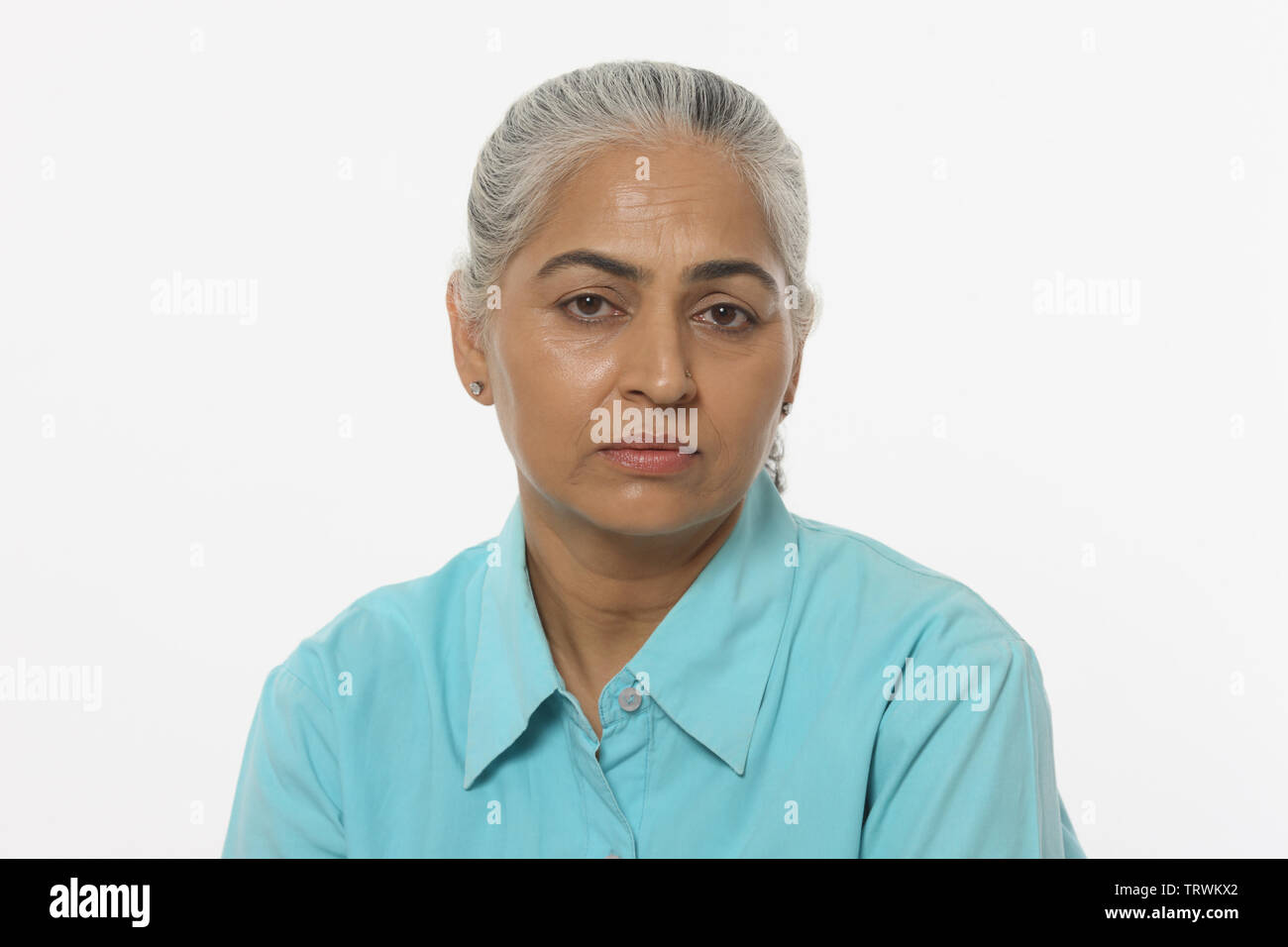 Portrait of a woman looking serious Stock Photo - Alamy