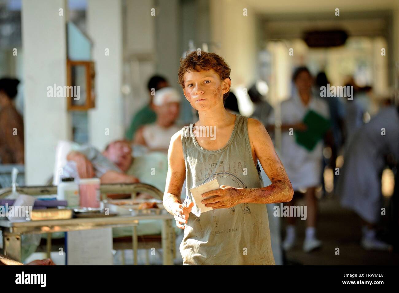 TOM HOLLAND in THE IMPOSSIBLE (2012). Copyright: Editorial use only. No ...
