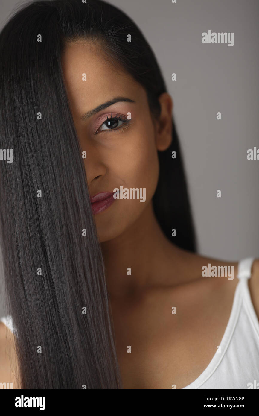 Woman beauty long hair over eye hi-res stock photography and images - Alamy