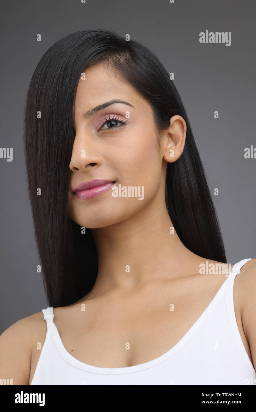 Close up of a beautiful young woman with hair over face Stock Photo - Alamy