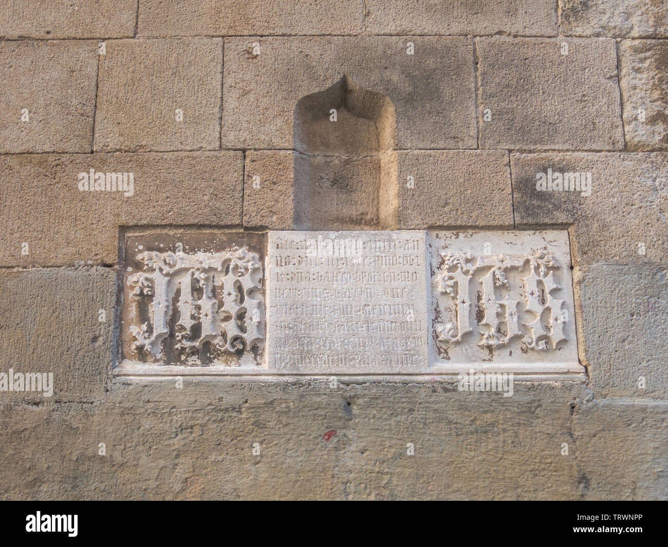 Detail of marble with Gothic writing, with a passage of the bible, on ...