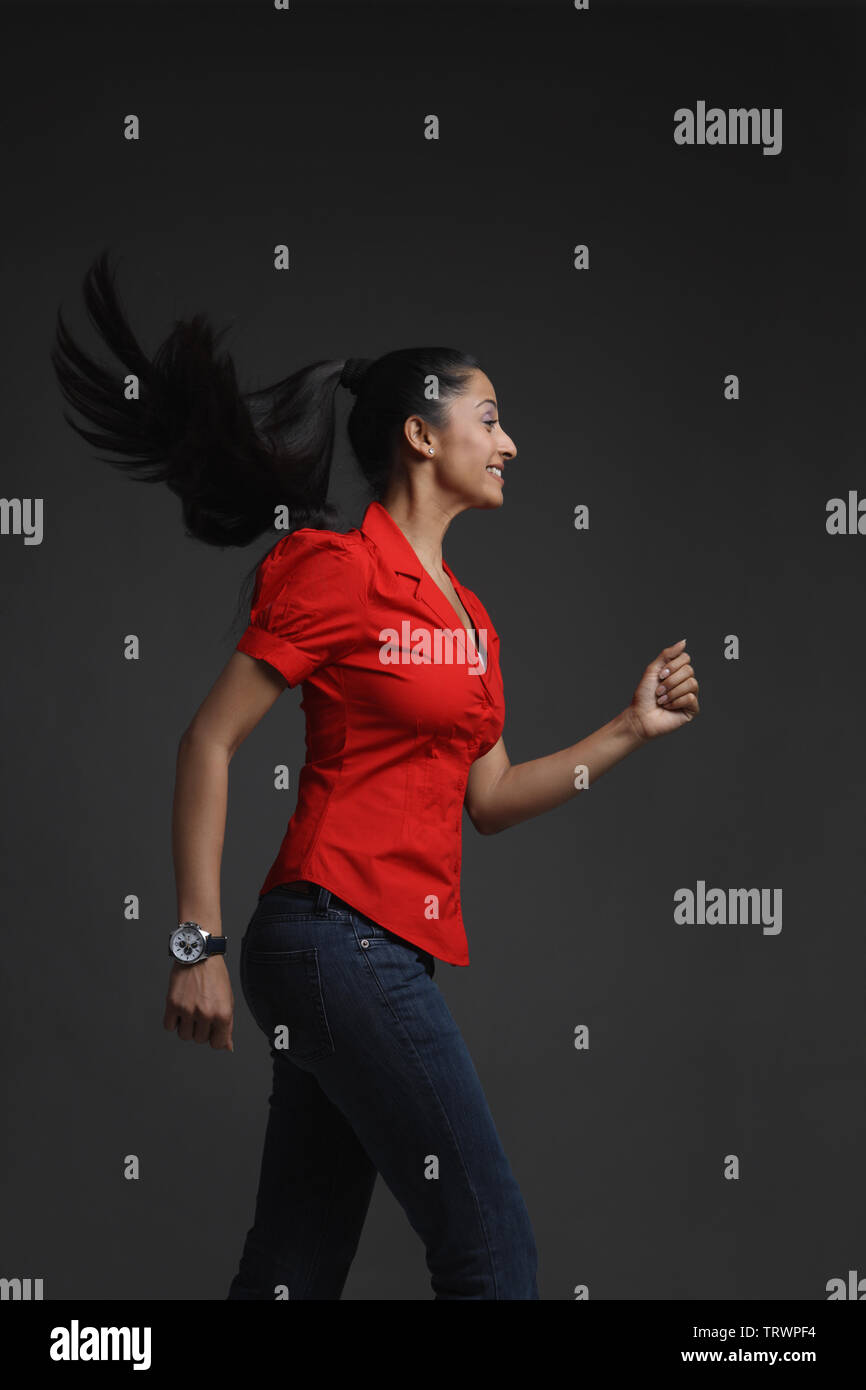 Side profile of a woman walking Stock Photo - Alamy
