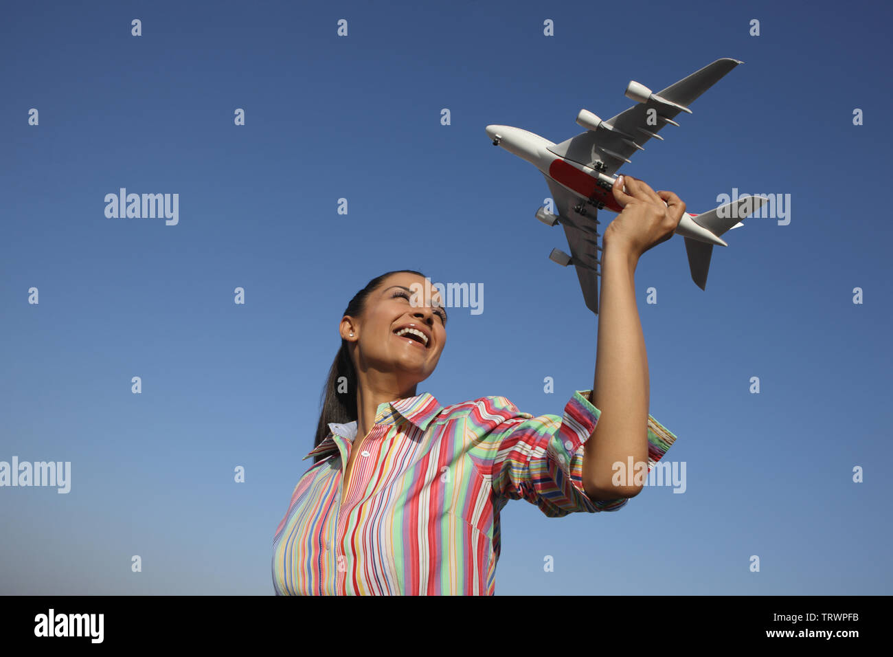 Woman holding mini toy hi-res stock photography and images - Alamy