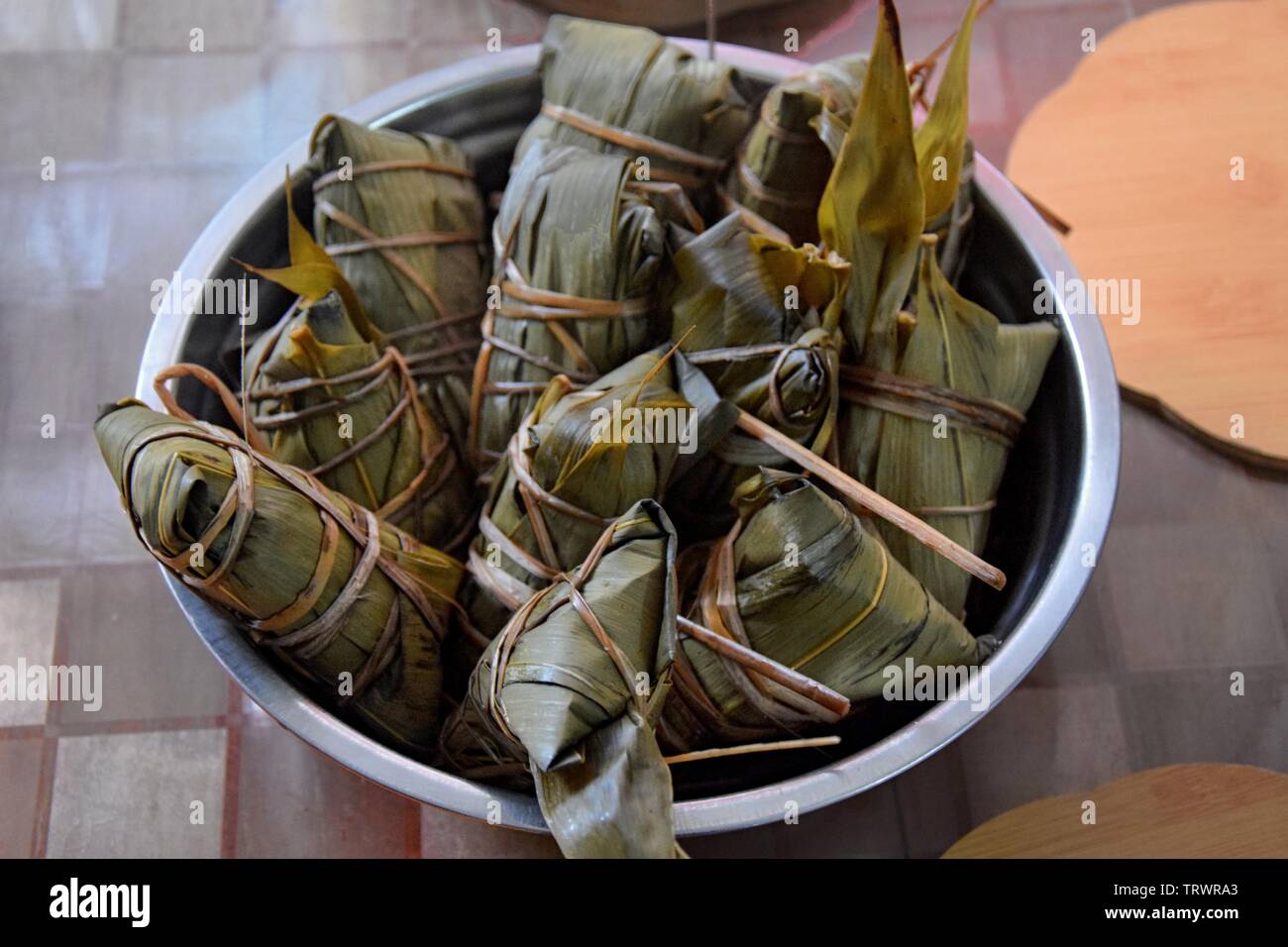 Rice dumpling wrapped in bamboo leaves hi-res stock photography and ...