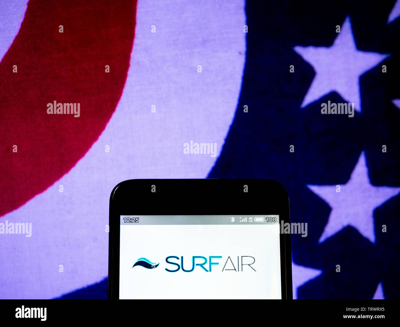 In this photo illustration the Surf Air logo is seen displayed on a smartphone Stock Photo - Alamy