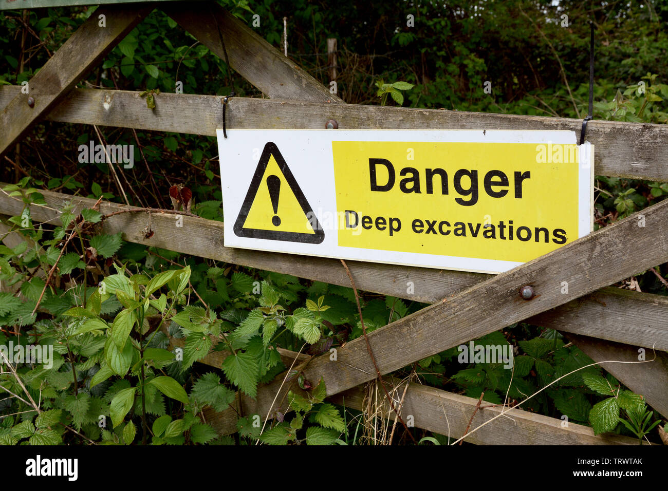 Warning sign - Danger Deep Excavations - fixed to a rustic wooden gate ...