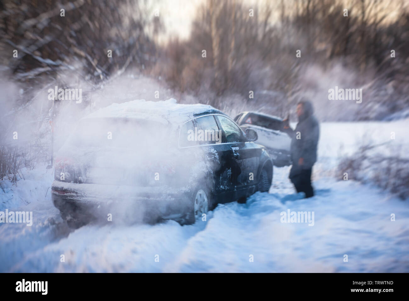 Process of taking out suv car stuck in snow, men digging and pushing ...
