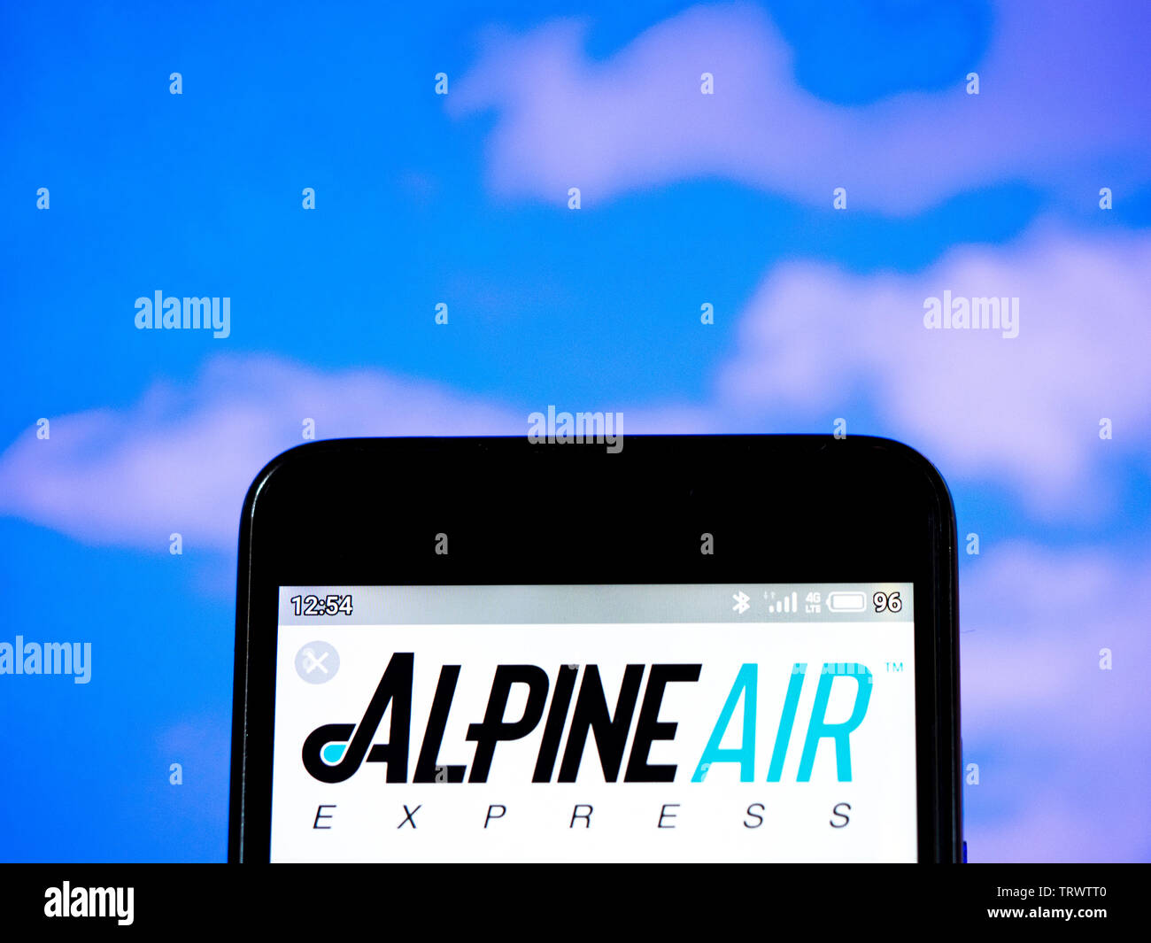 In this photo illustration the Alpine Air Express logo is seen ...