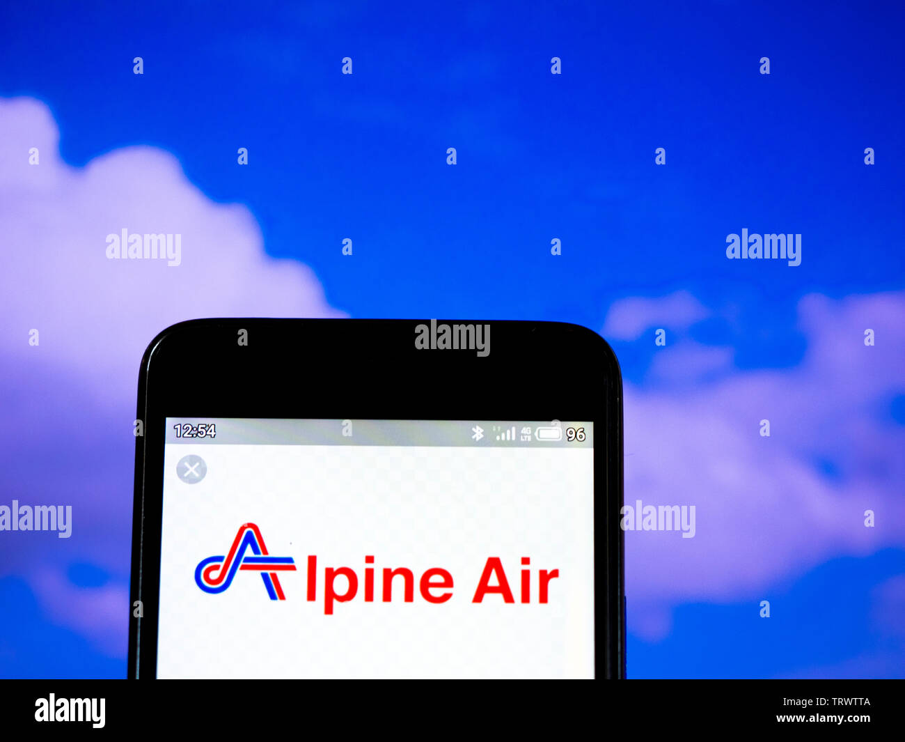 In this photo illustration the Alpine Air Express logo is seen ...