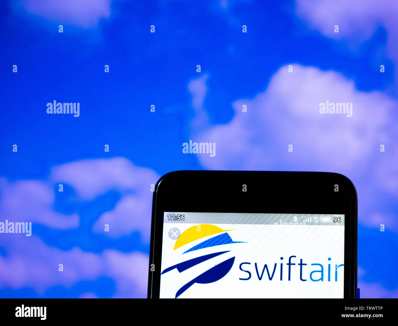 In this photo illustration the Swift Air logo is seen displayed on a ...