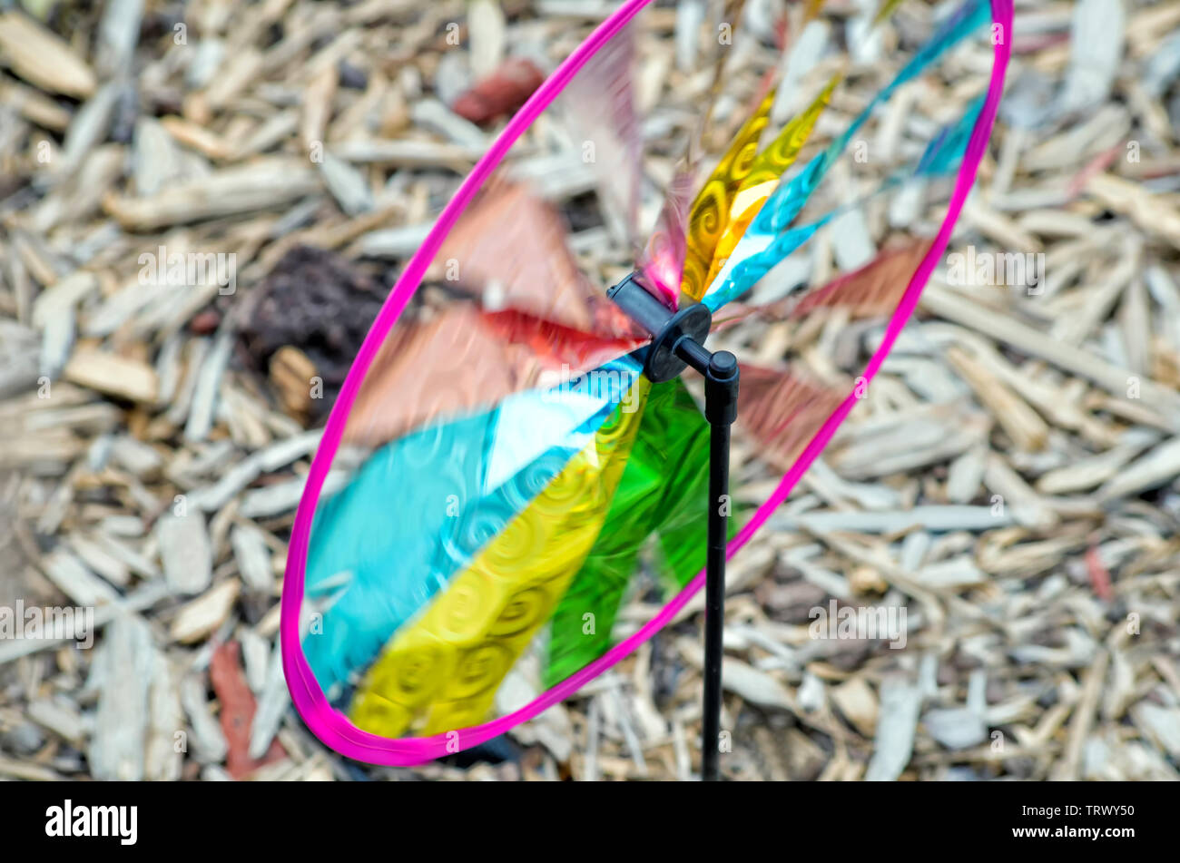 A pinwheel spinning with motion blur and blurred background Stock Photo ...
