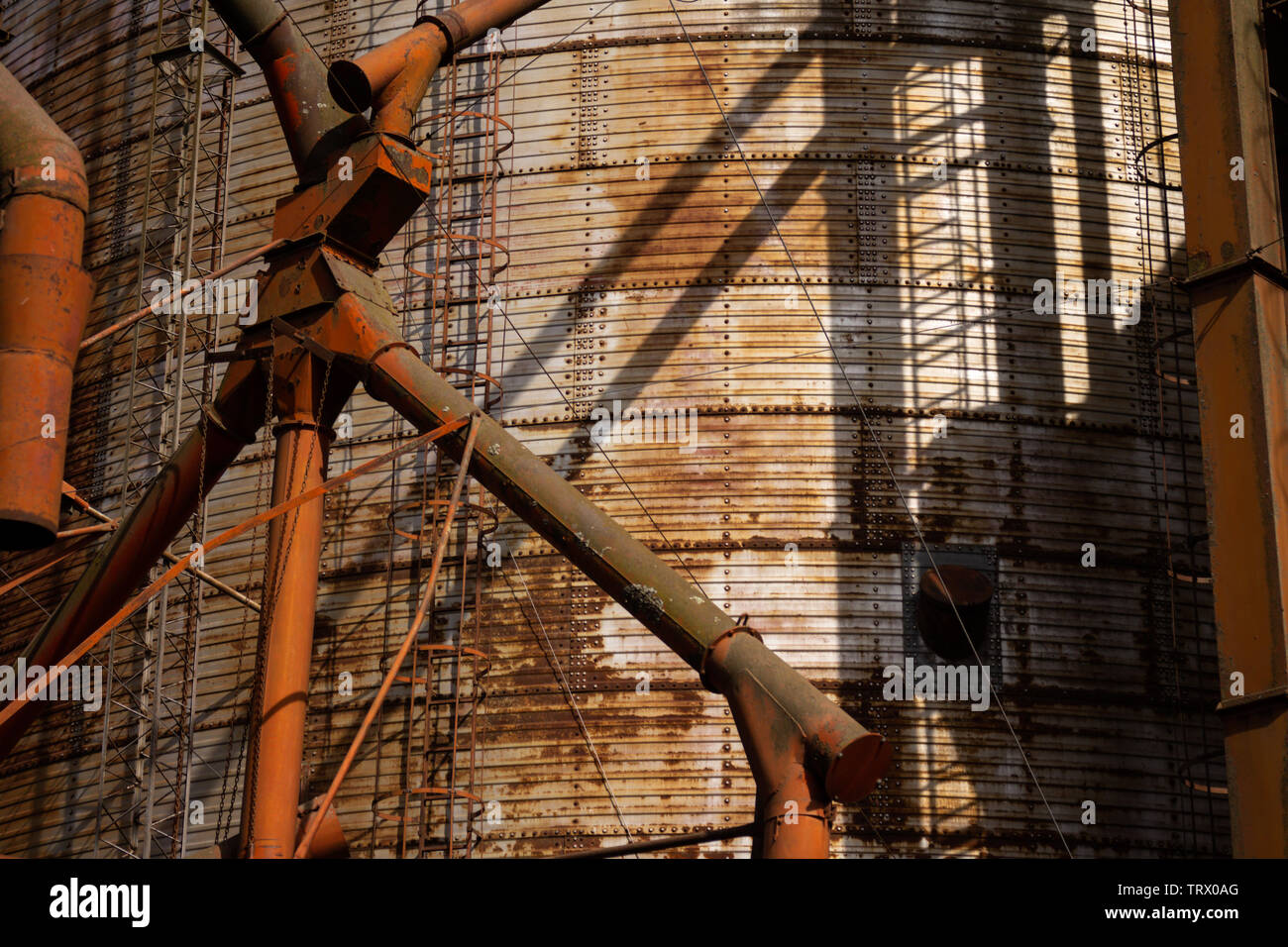 Close up view of an old rusty silo used to gather corn Stock Photo - Alamy