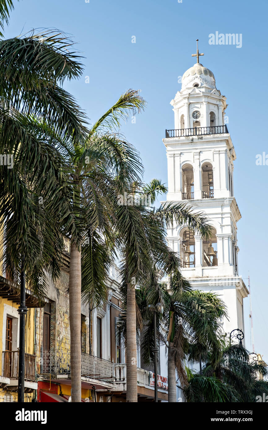 The Cathedral of Veracruz towers above the palm trees lining the Plaza ...