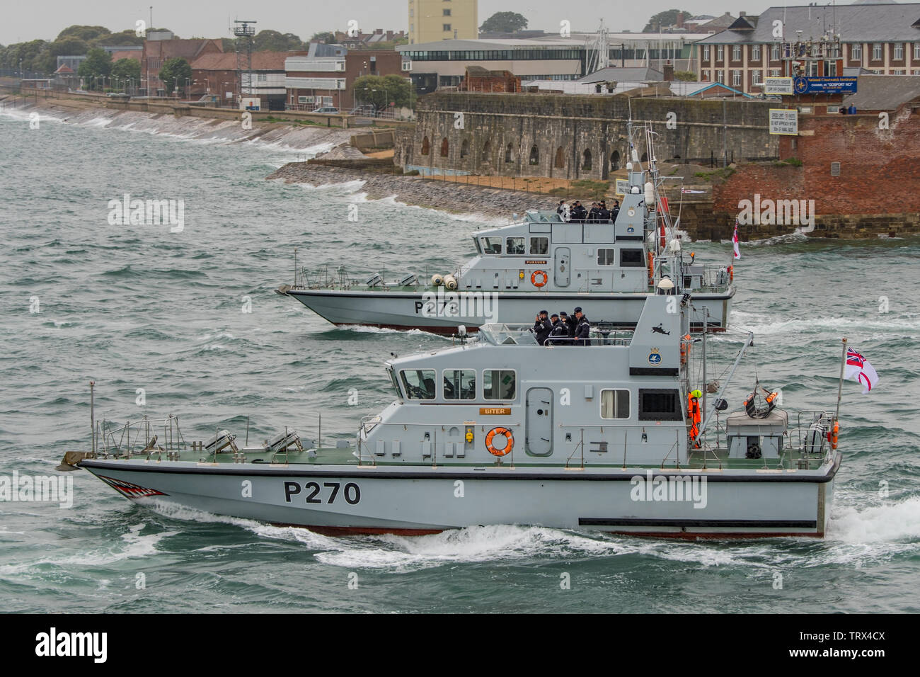 Royal Navy patrol boats HMS Biter (with the sharks teeth artwork on the ...