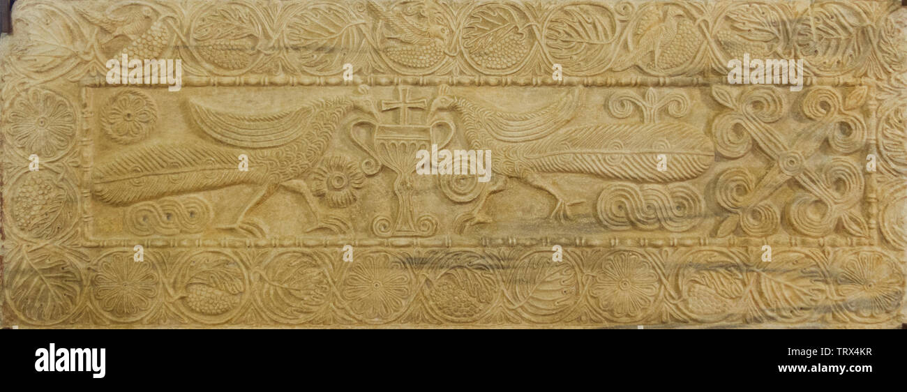 Two peacocks drinking from a cantharus (kantharos), an ancient Greek ...