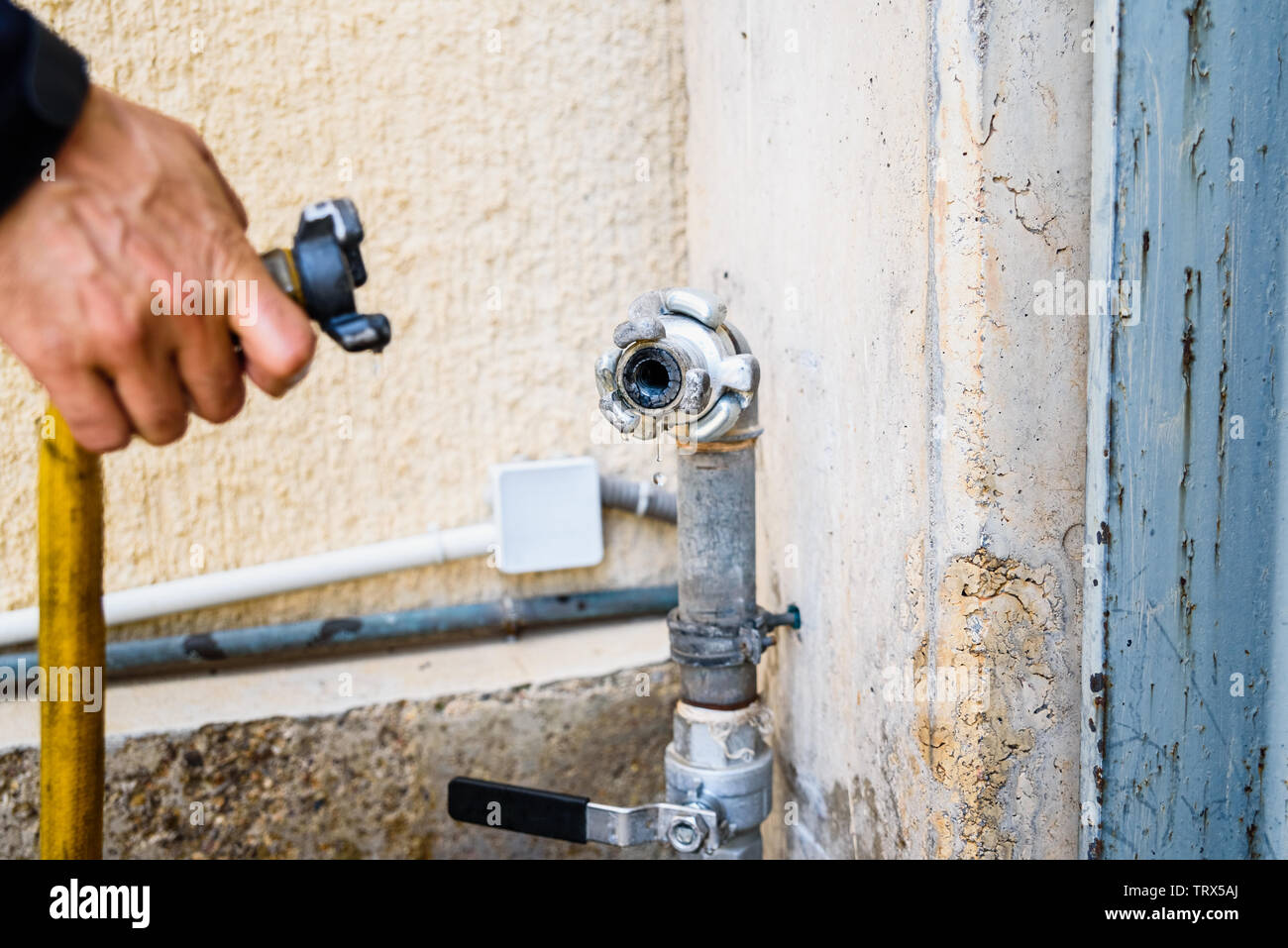 Hose tap child hi-res stock photography and images - Alamy