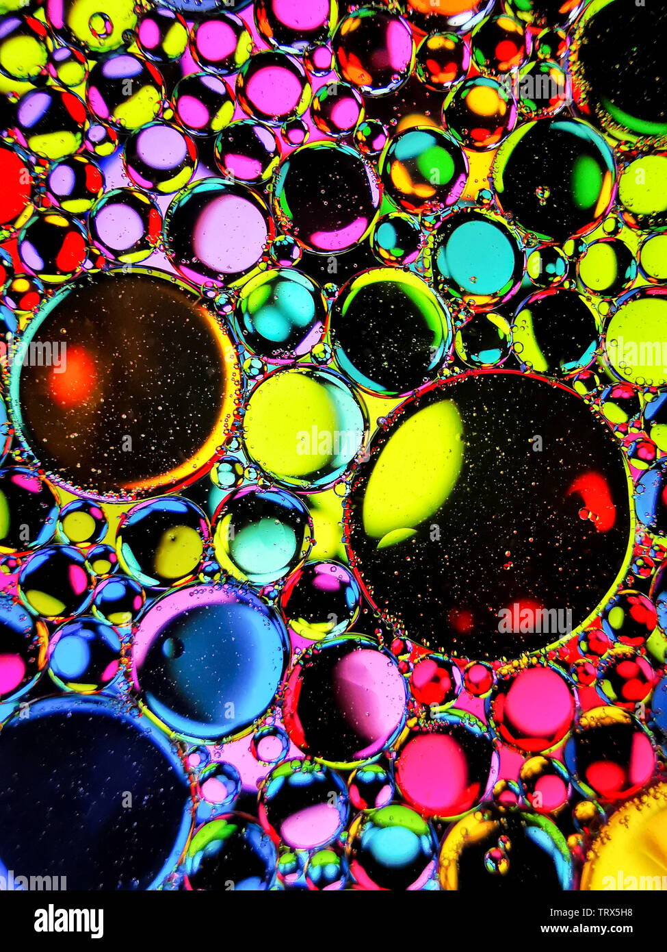 neon rainbow colorful oil bubbles abstract textures for backgrounds Stock Photo - Alamy