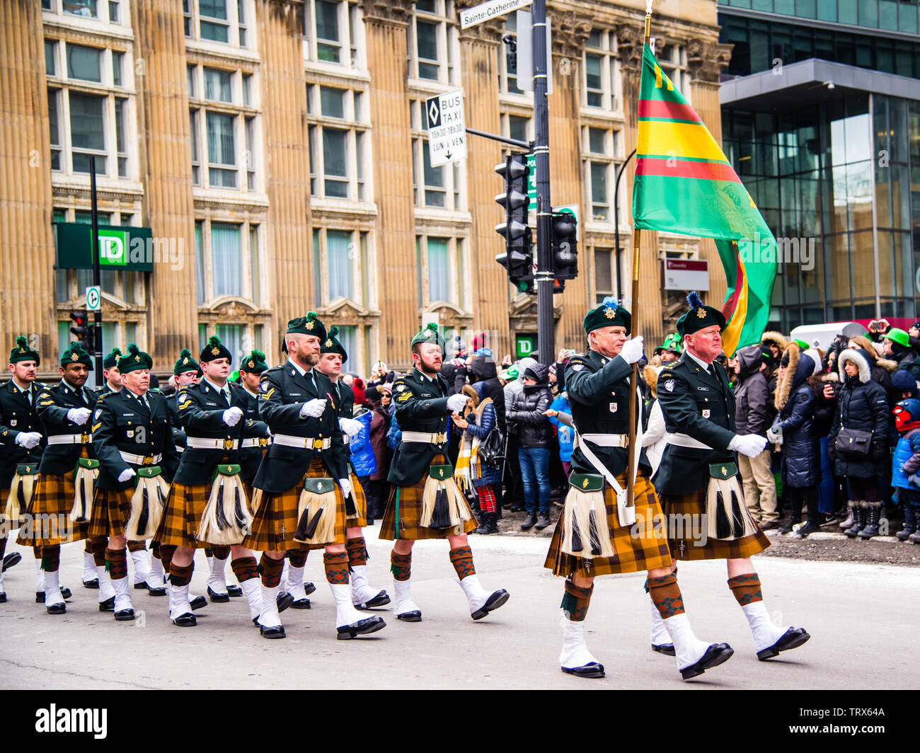 Marching band with traditional British uniform parading in the Saint ...